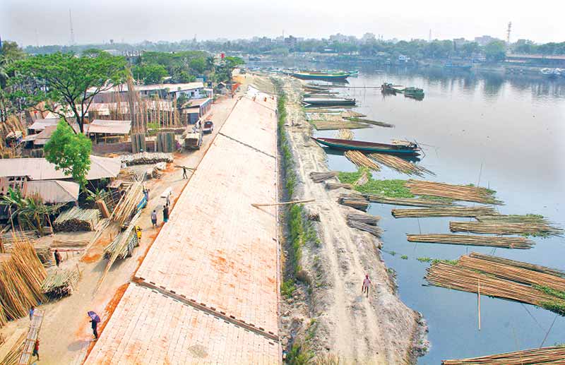 Paved embankment built along the bank of the Shitalakhya River